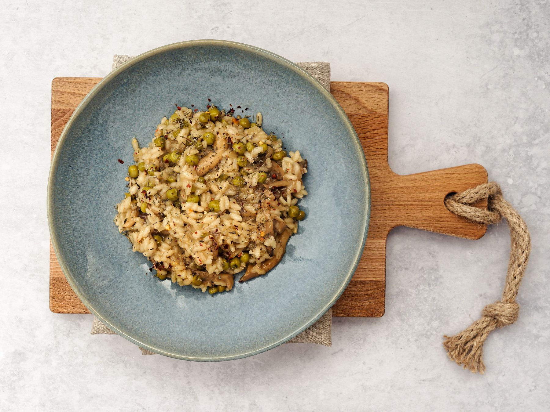 Vegan risotto met champignons en doperwten | PLANTPROEF